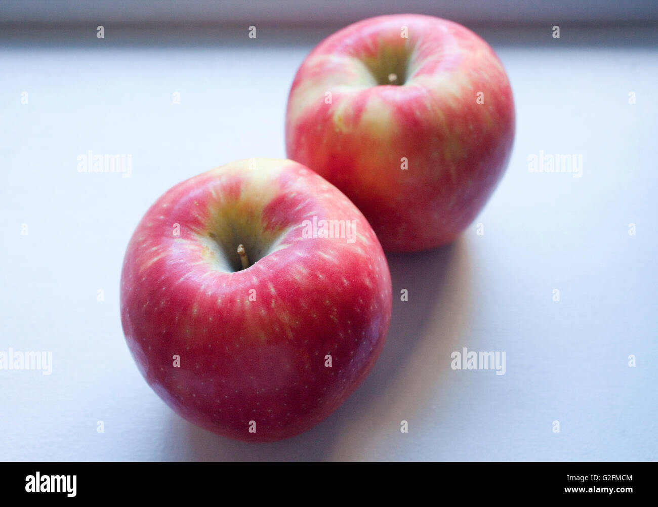 two apples on counter Stock Photo - Alamy