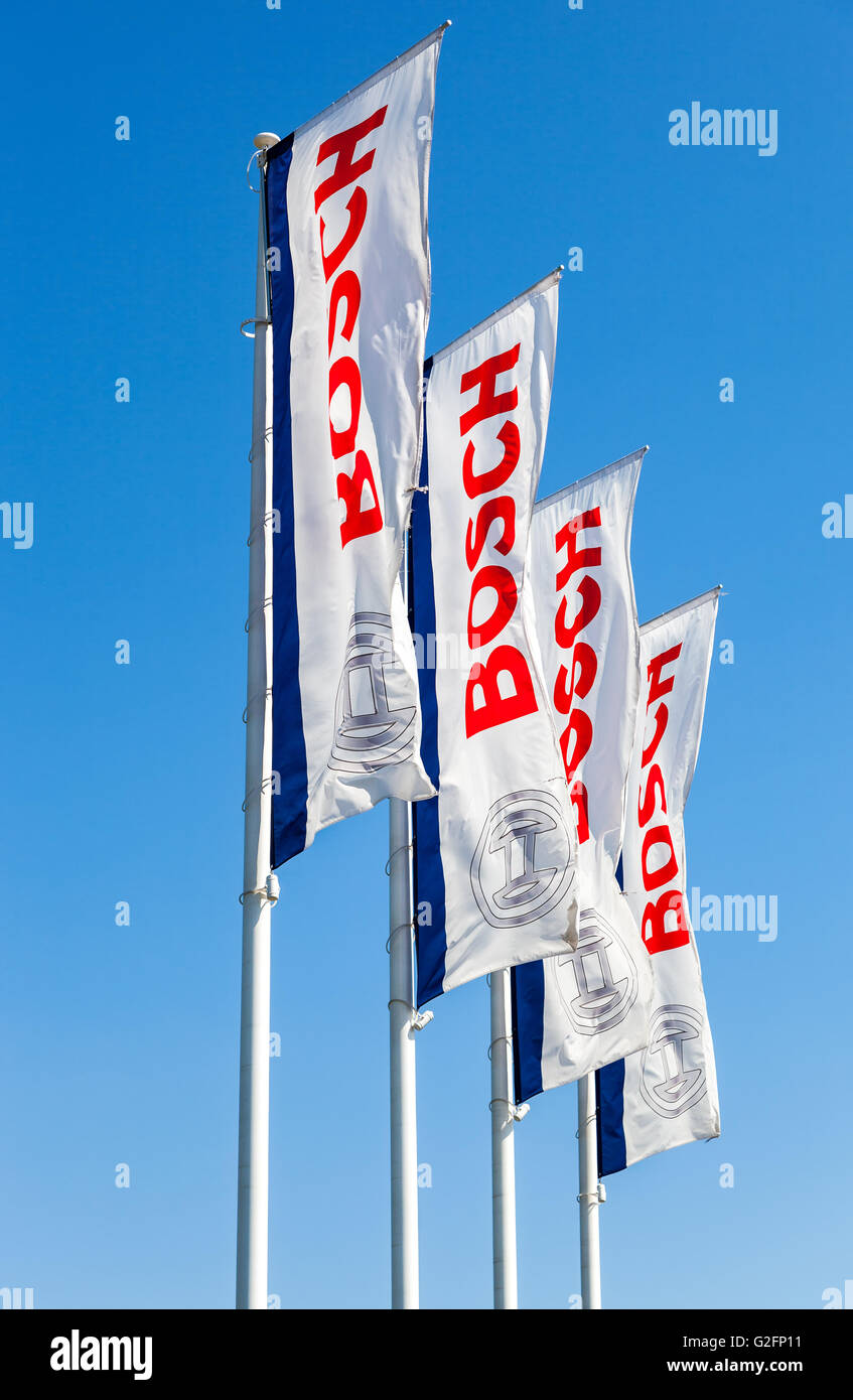 Flags with emblem Bosch against the blue sky Stock Photo - Alamy