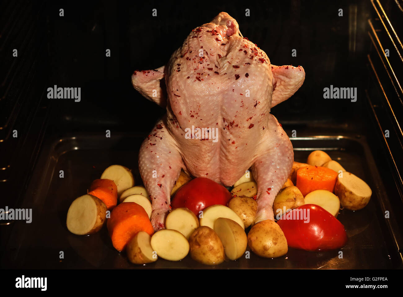 raw chicken in oven ready for cooking Stock Photo - Alamy