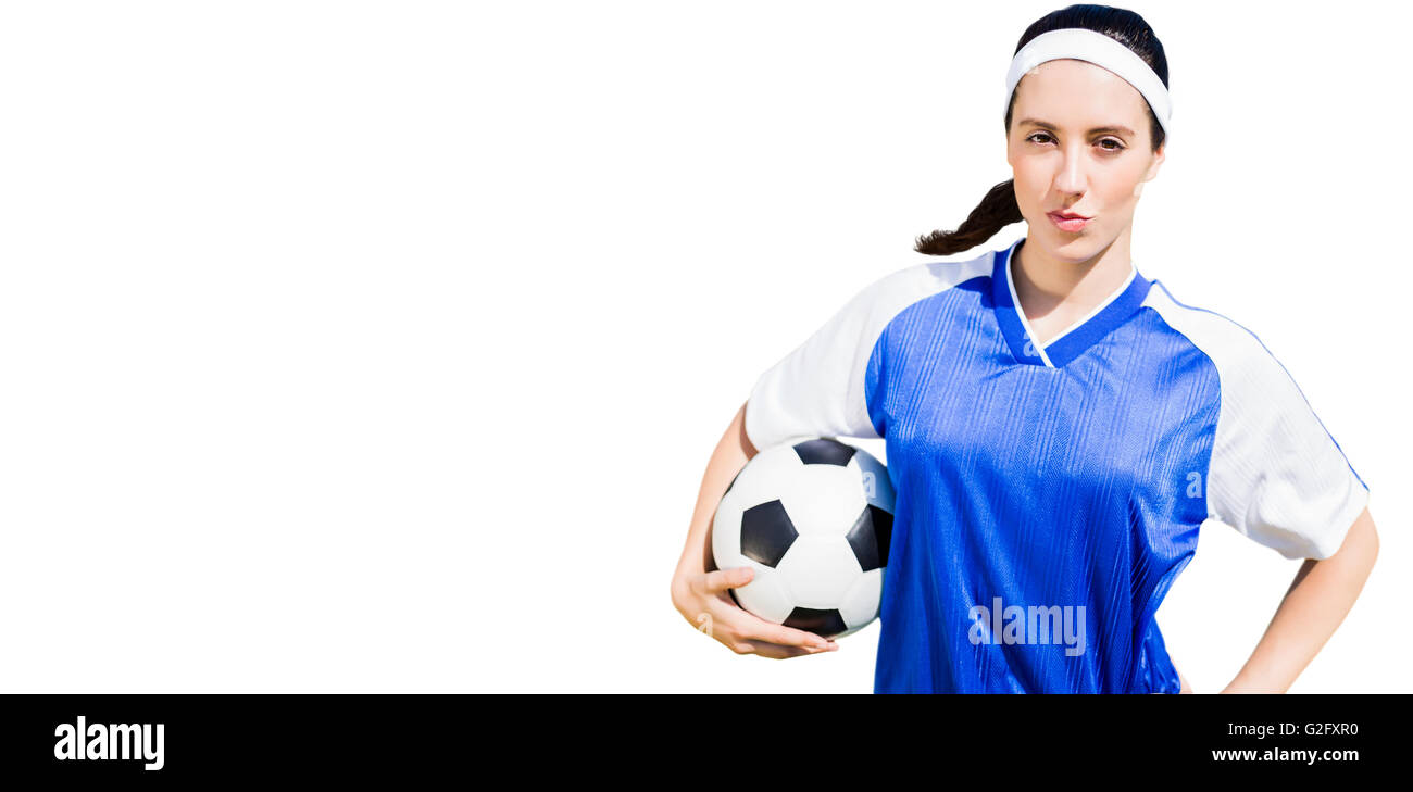 Woman football player posing with football Stock Photo - Alamy