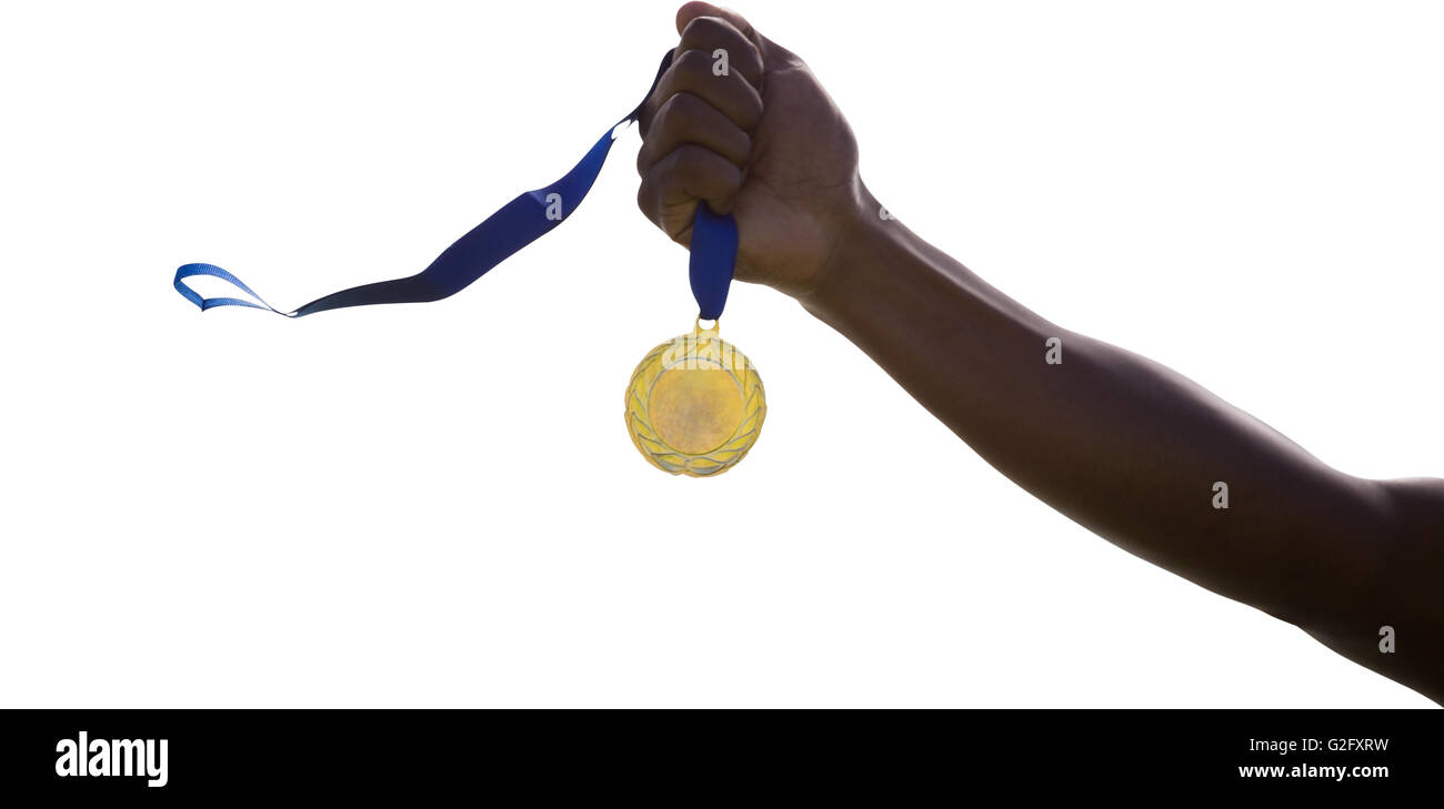 Hand holding a gold medal Stock Photo - Alamy