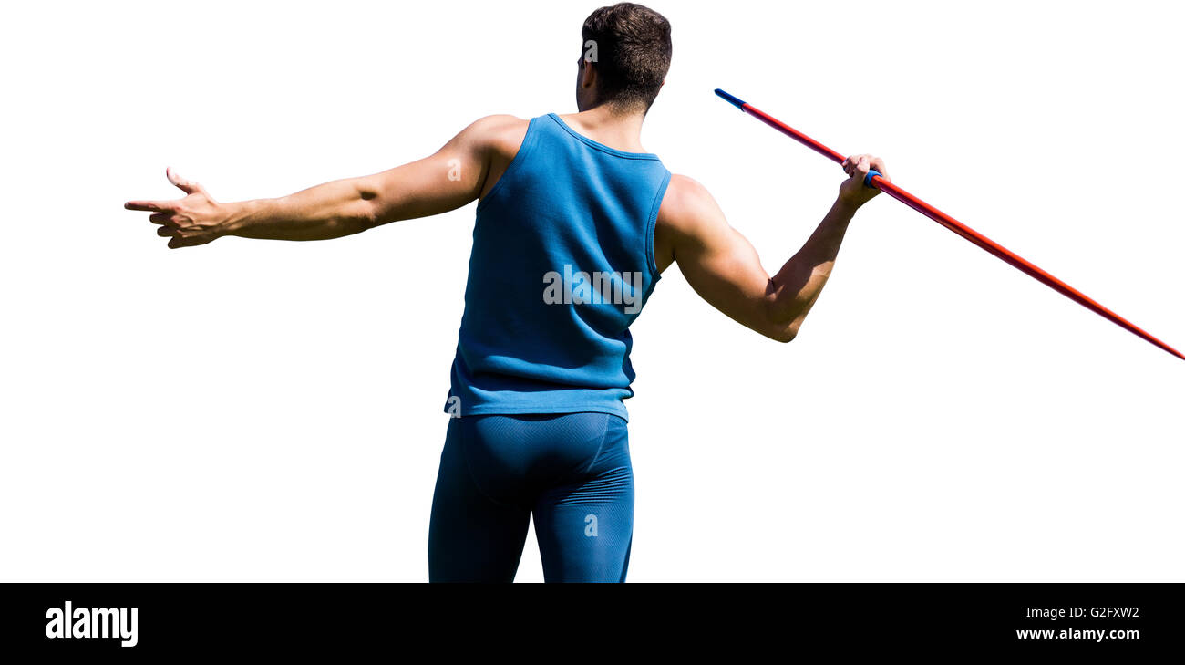 Rear view of sportsman practising javelin throw Stock Photo - Alamy