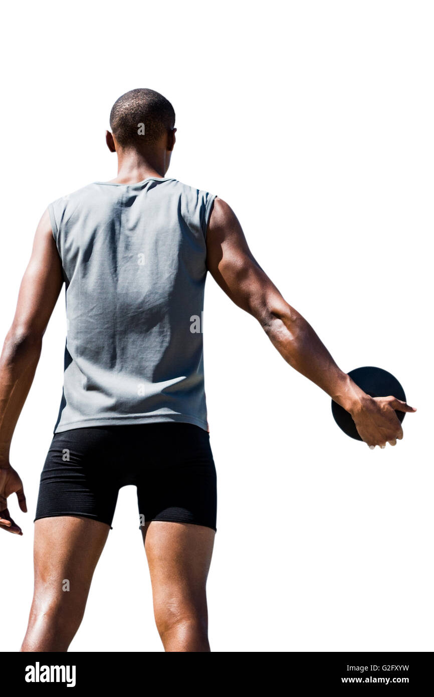Rear view of sportsman holding a discus Stock Photo - Alamy