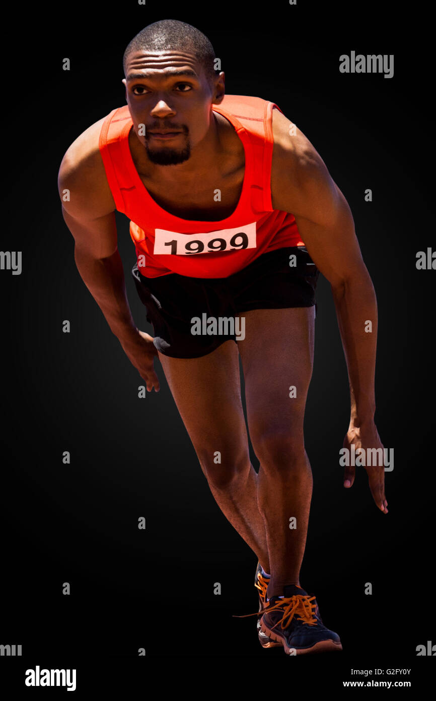 Handsome man preparing to start running Stock Photo - Alamy
