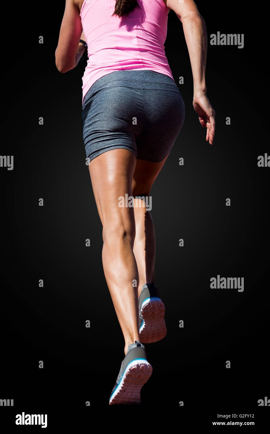 Rear view of sportswoman running Stock Photo - Alamy