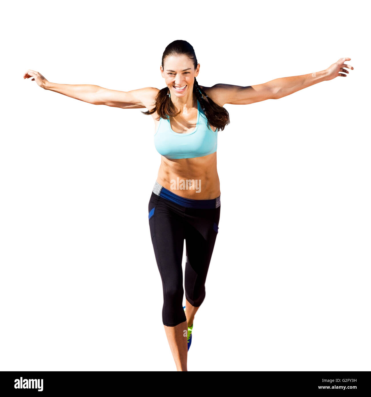Happy sportswoman is raising arms Stock Photo - Alamy