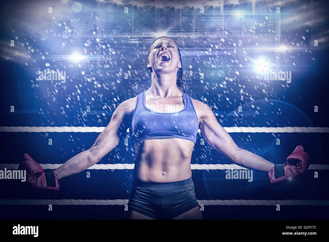 Composite image of winning fighter with arms outstretched Stock Photo ...