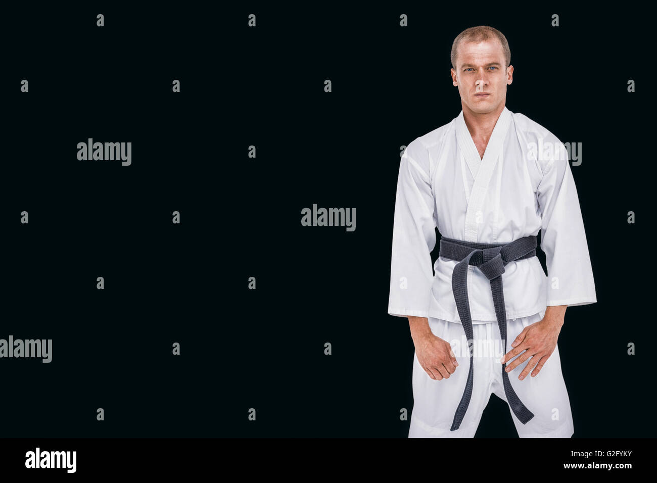 Composite image of confident fighter standing against white background ...