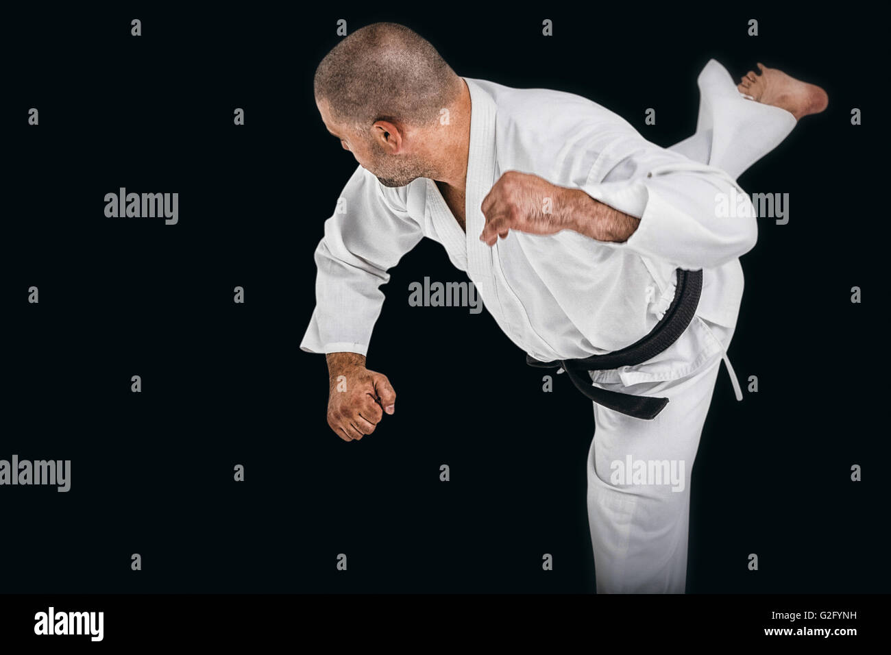 Composite image of fighter performing karate stance Stock Photo - Alamy