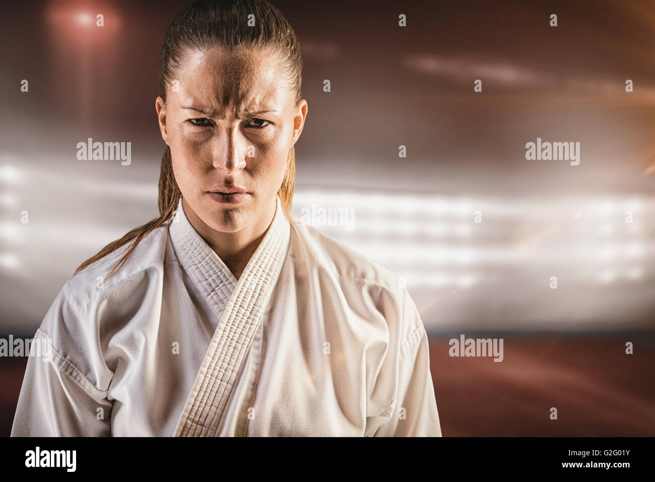 Composite image of female fighter on black background Stock Photo - Alamy