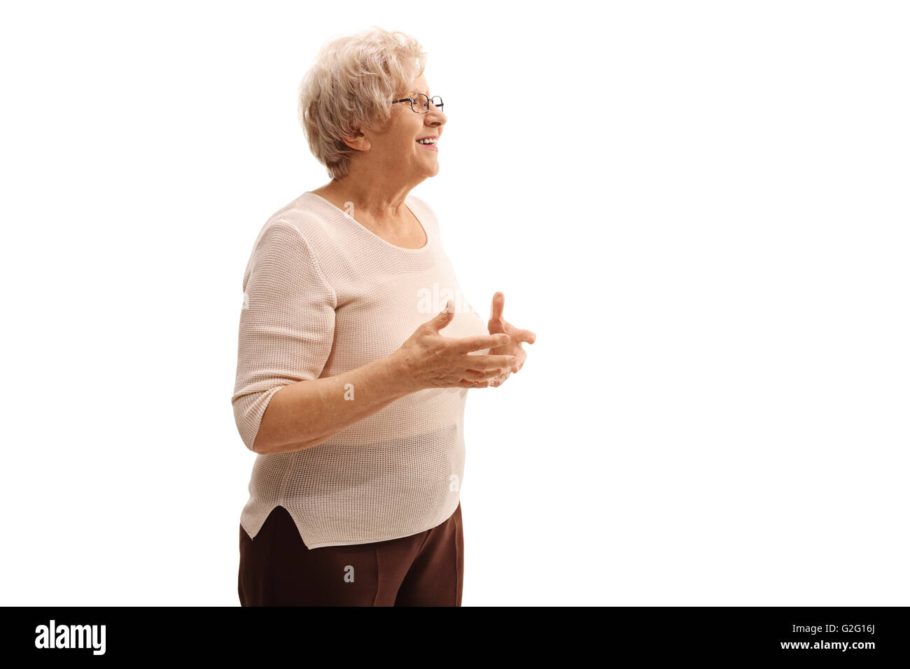 Elderly lady talking to someone and explaining something isolated on ...