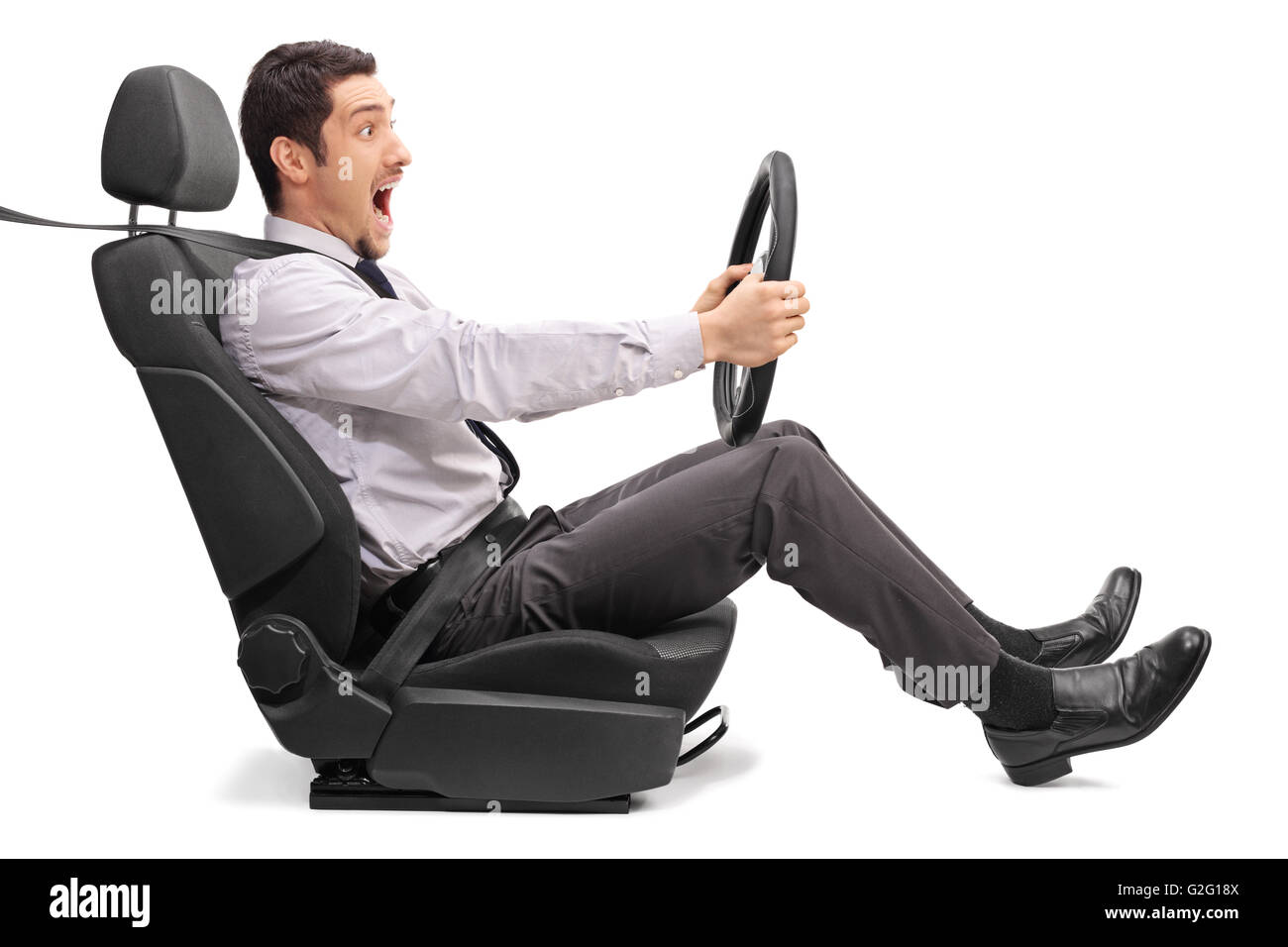 Excited young man driving fast and enjoying himself isolated on white ...