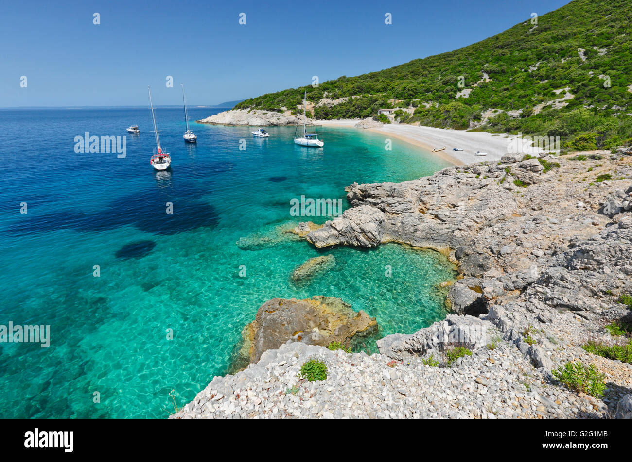 Beautiful beach with sailboats under Lubenice village on island Cres ...