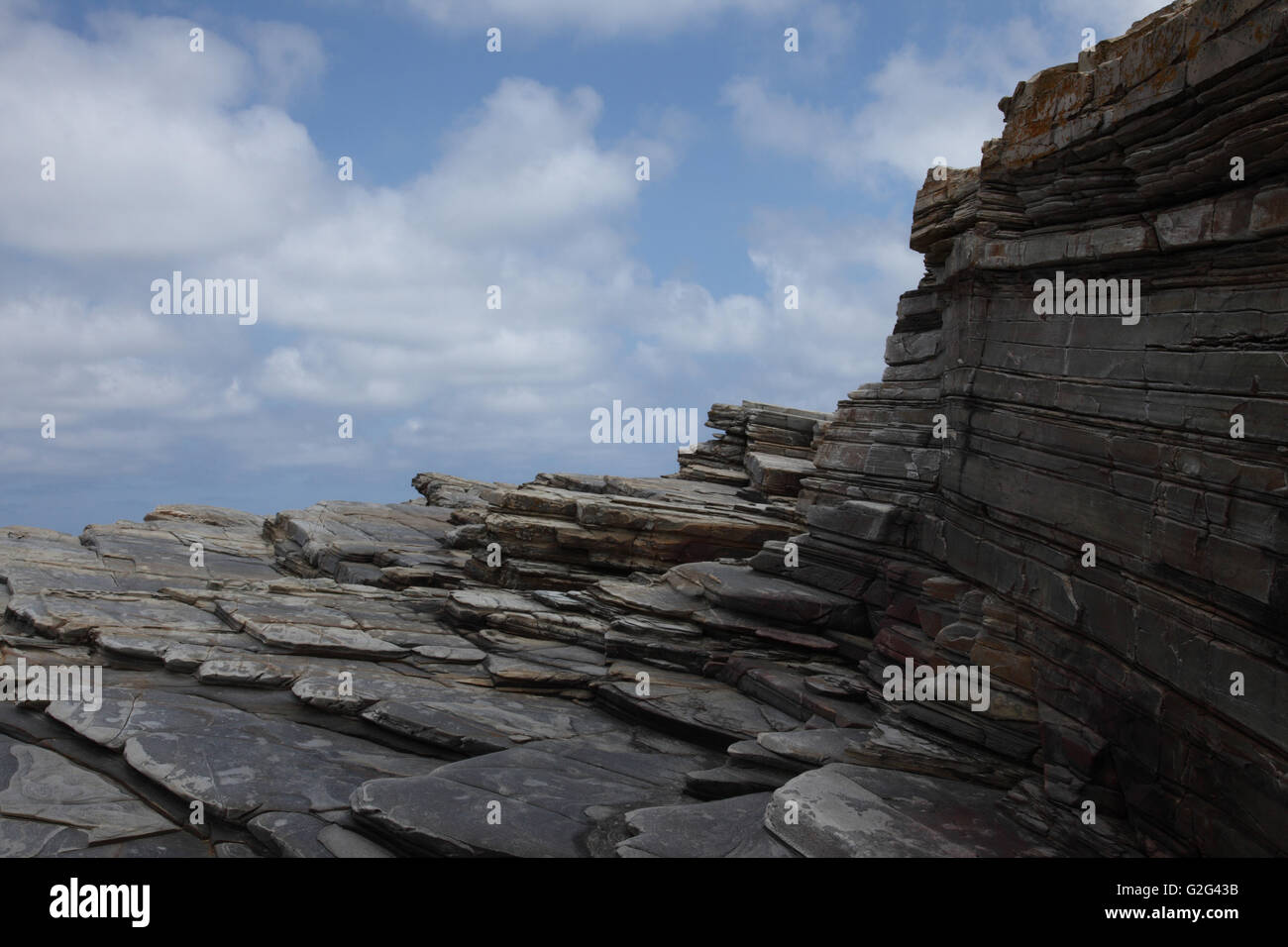 Rock Formation Layers with Clouds and Blue Sky Stock Photo - Alamy