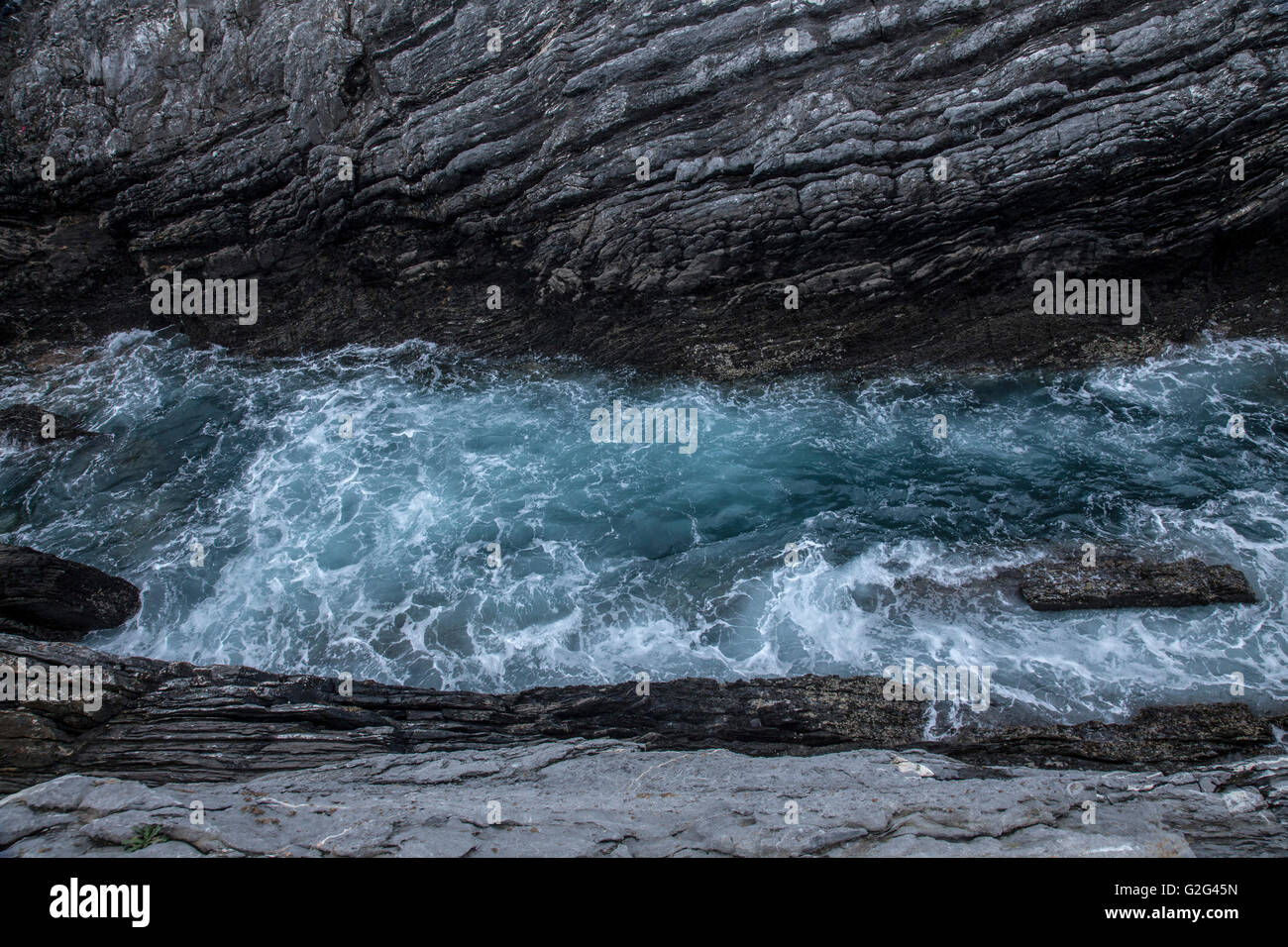Churning Water Between Two Coastal Rock Formations Stock Photo - Alamy