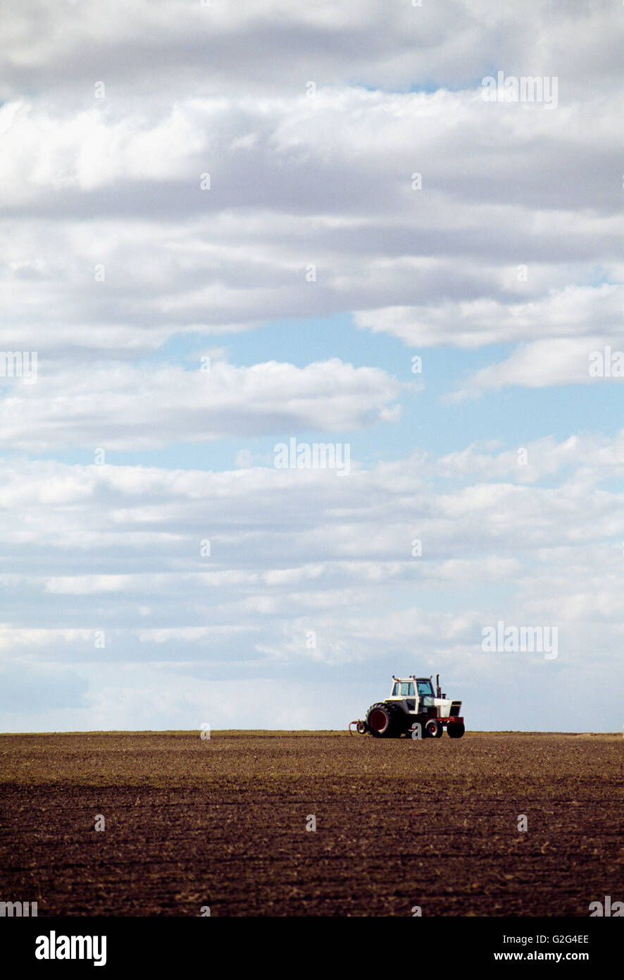 Tractor in Field 2 Stock Photo - Alamy