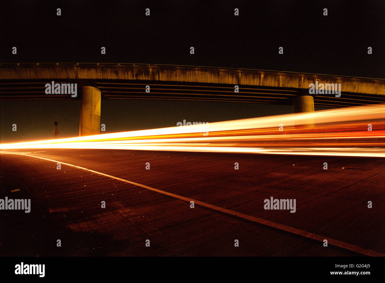 Beams of Light Along Highway at Night Stock Photo - Alamy