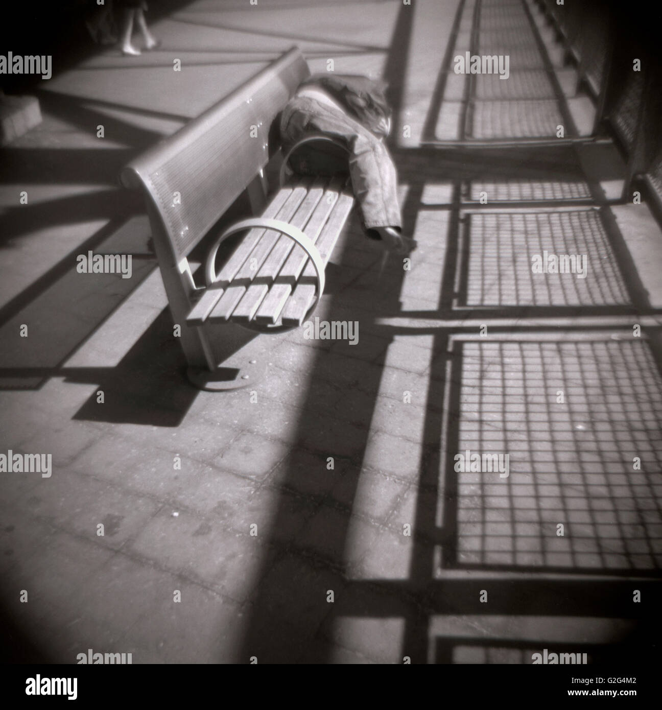 Homeless Man Sleeping on Bench, New York City, USA Stock Photo - Alamy