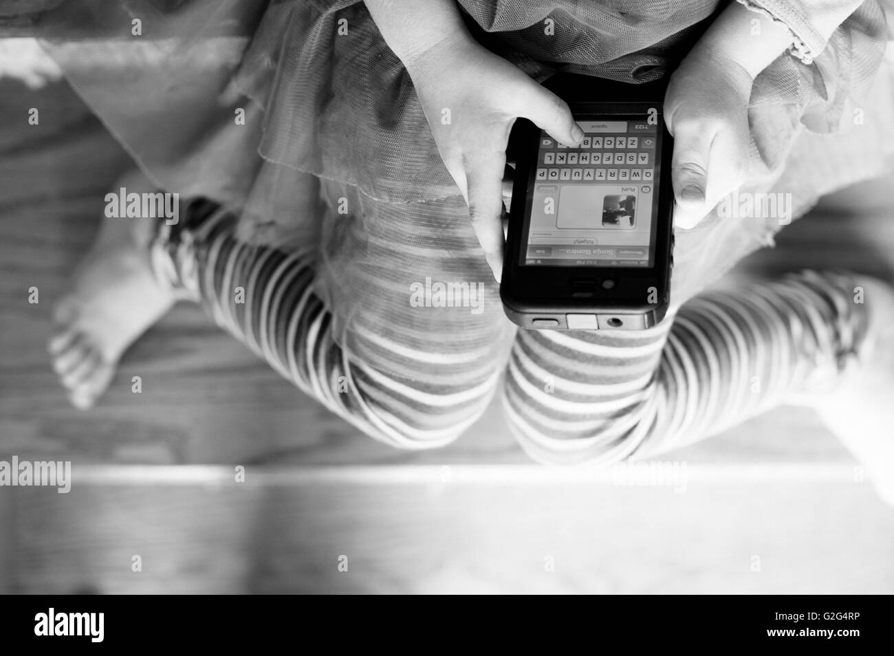 Young Girl Sending Text Message on Mobile Phone Stock Photo - Alamy