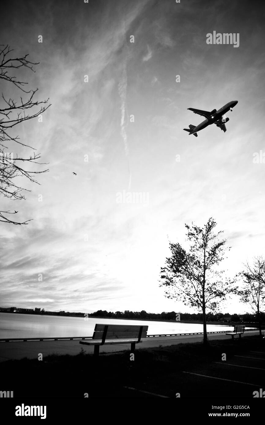 Airplane Flying Over Park Stock Photo - Alamy