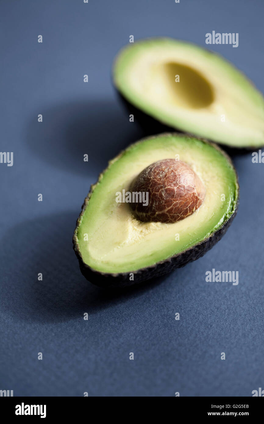 Avocado Cut in Half Stock Photo - Alamy