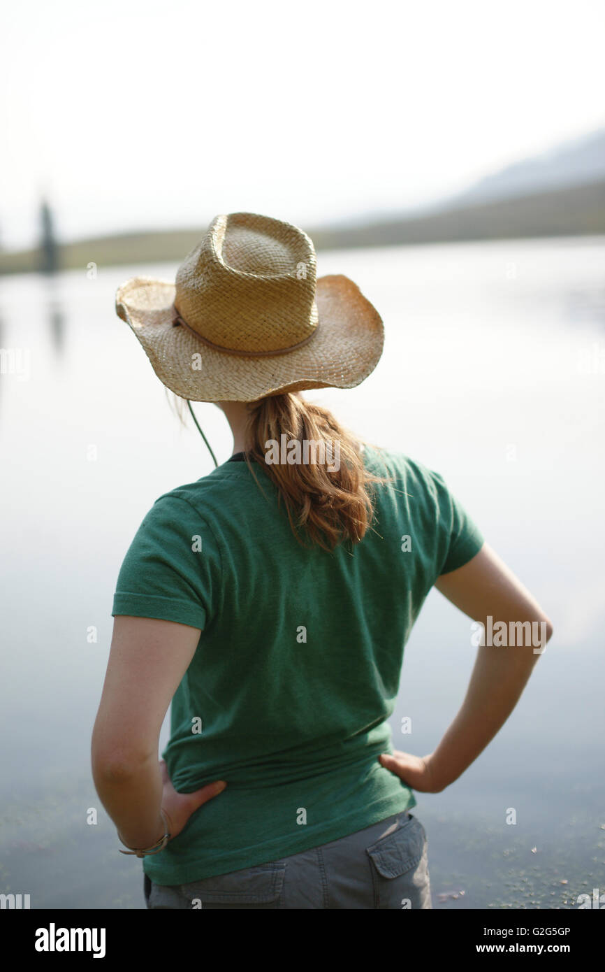 Teenage Girl in Hat Staring at Lake Stock Photo - Alamy