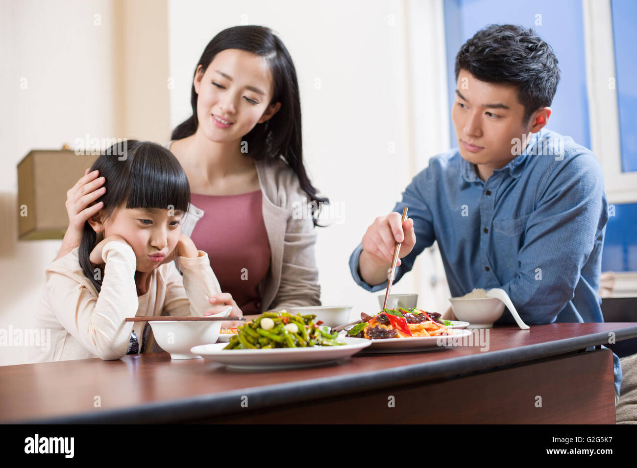 Little girl refusing to have lunch Stock Photo - Alamy