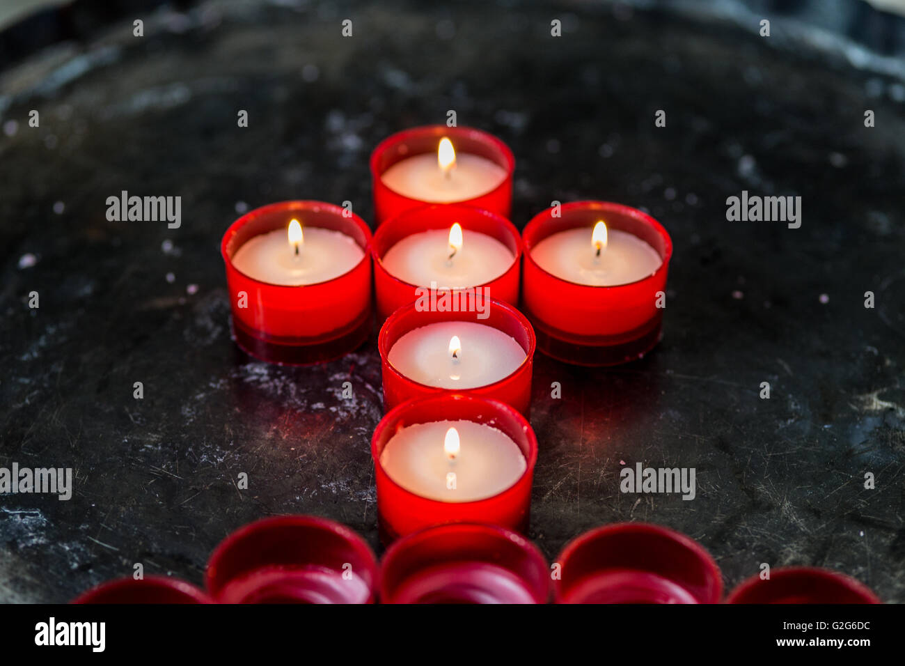 Cross formed of votive candles Stock Photo - Alamy