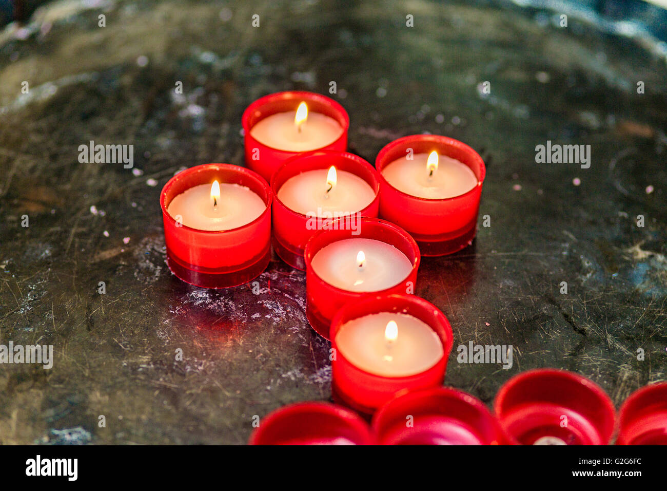 Cross formed of votive candles Stock Photo - Alamy
