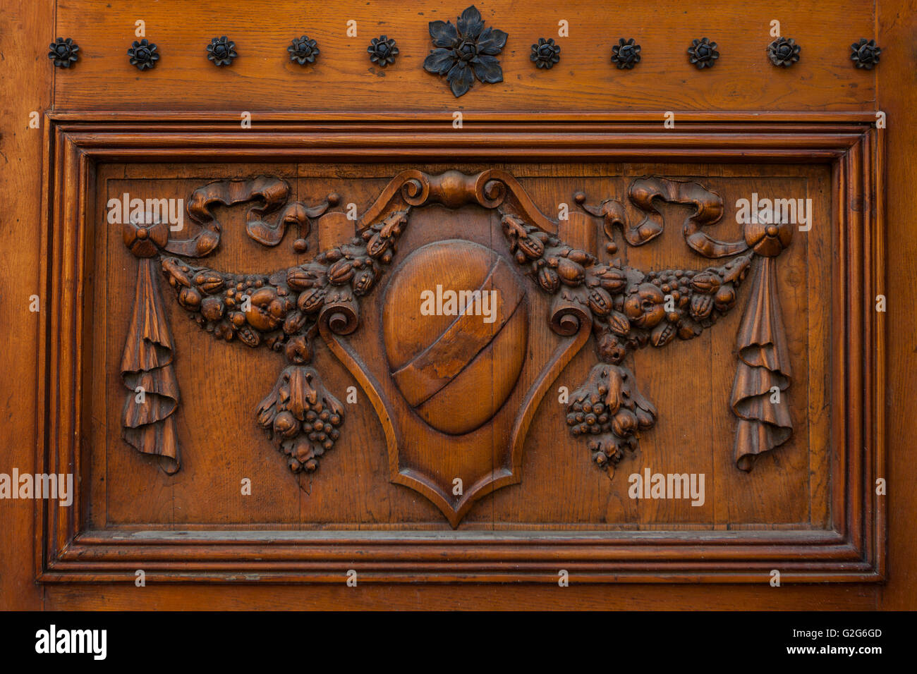 Old brown Wood door carved ornament panel with black metal flowers ...