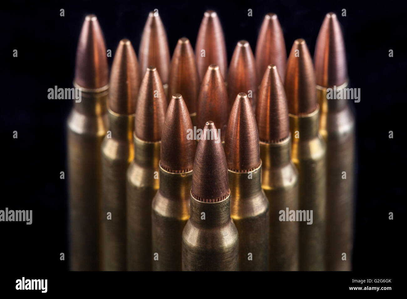Rifle bullets close-up on black background Stock Photo - Alamy
