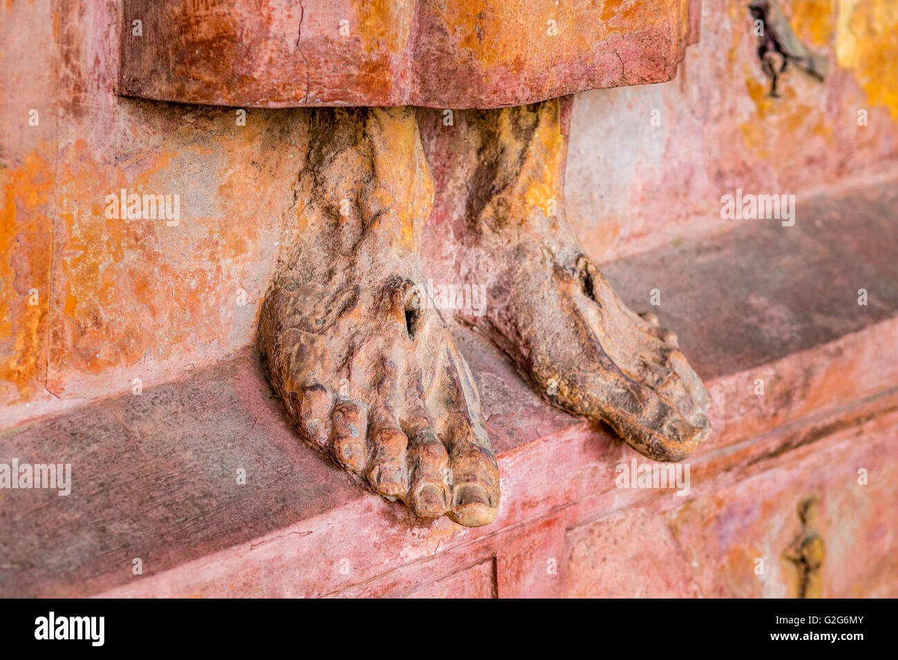 details of ancient statue, feet with stigmata Stock Photo - Alamy