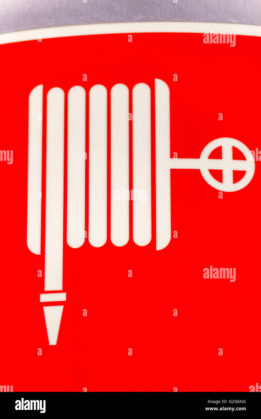 red signal indication of fire hydrant and hose reel on round steel ...