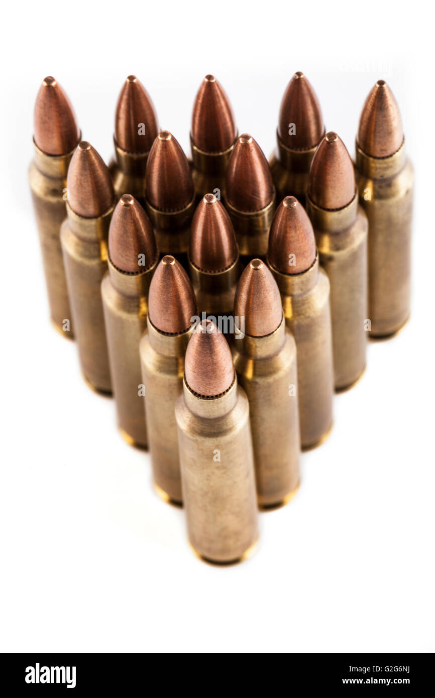 Rifle bullets triangle close-up isolated on white background Stock ...