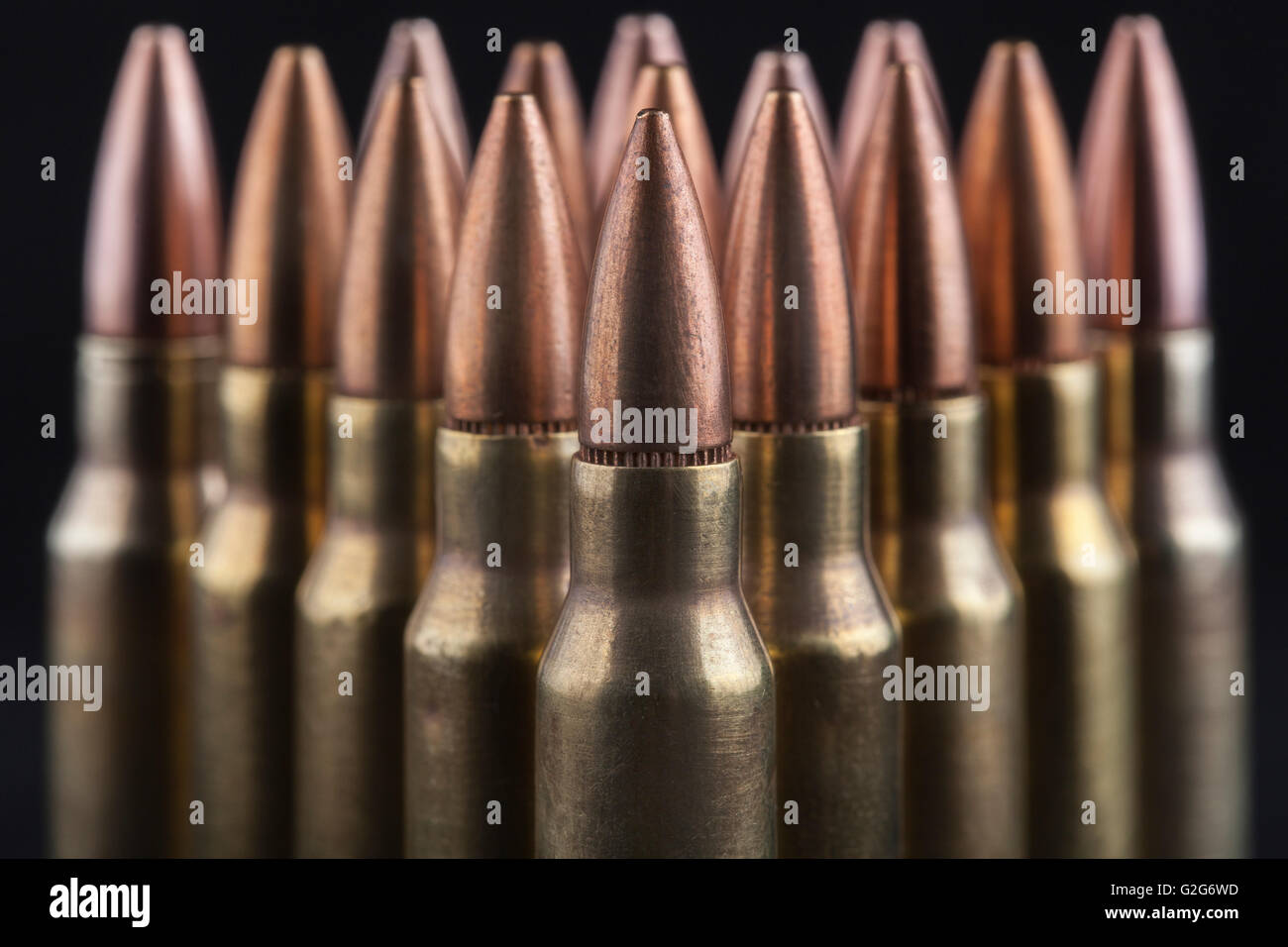 Rifle bullets close-up on black background Stock Photo - Alamy