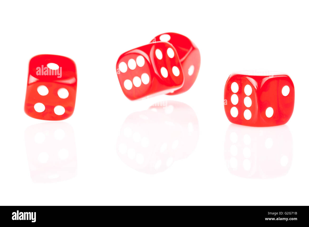 Four red bouncing dice isolated on white background with reflection ...