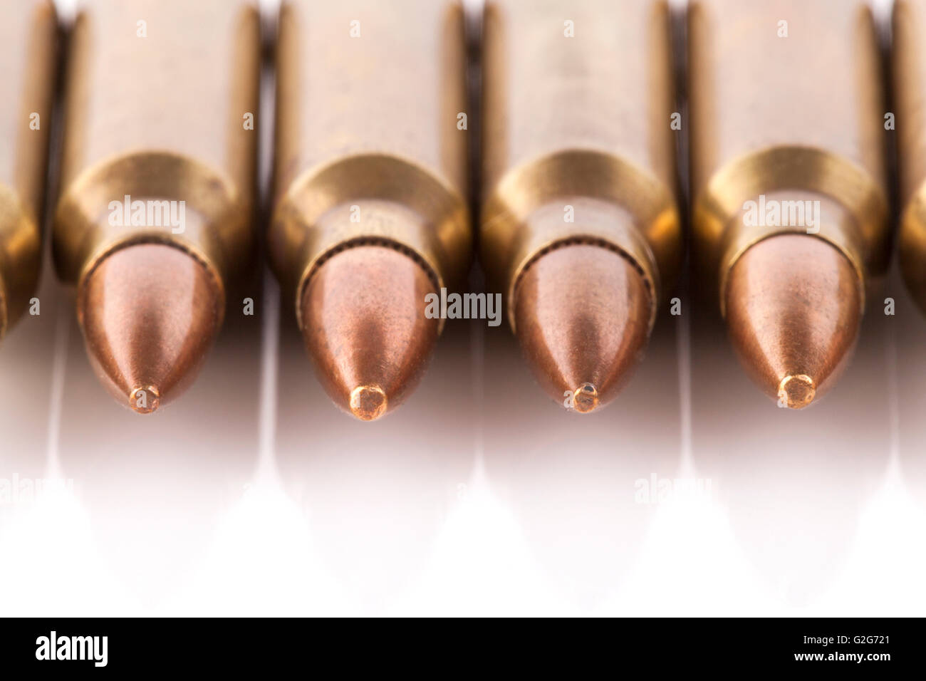 Rifle bullets frontal close-up isolated on white background with ...