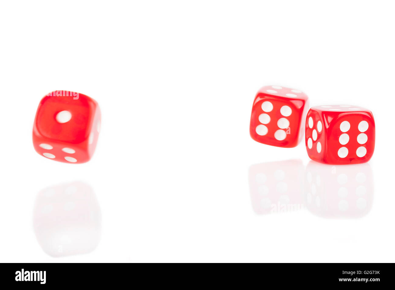 Three red bouncing dice isolated on white background with reflection ...