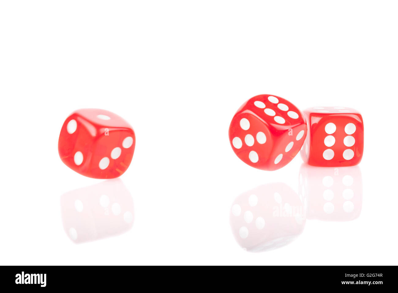 Three red bouncing dice isolated on white background with reflection Stock Photo - Alamy