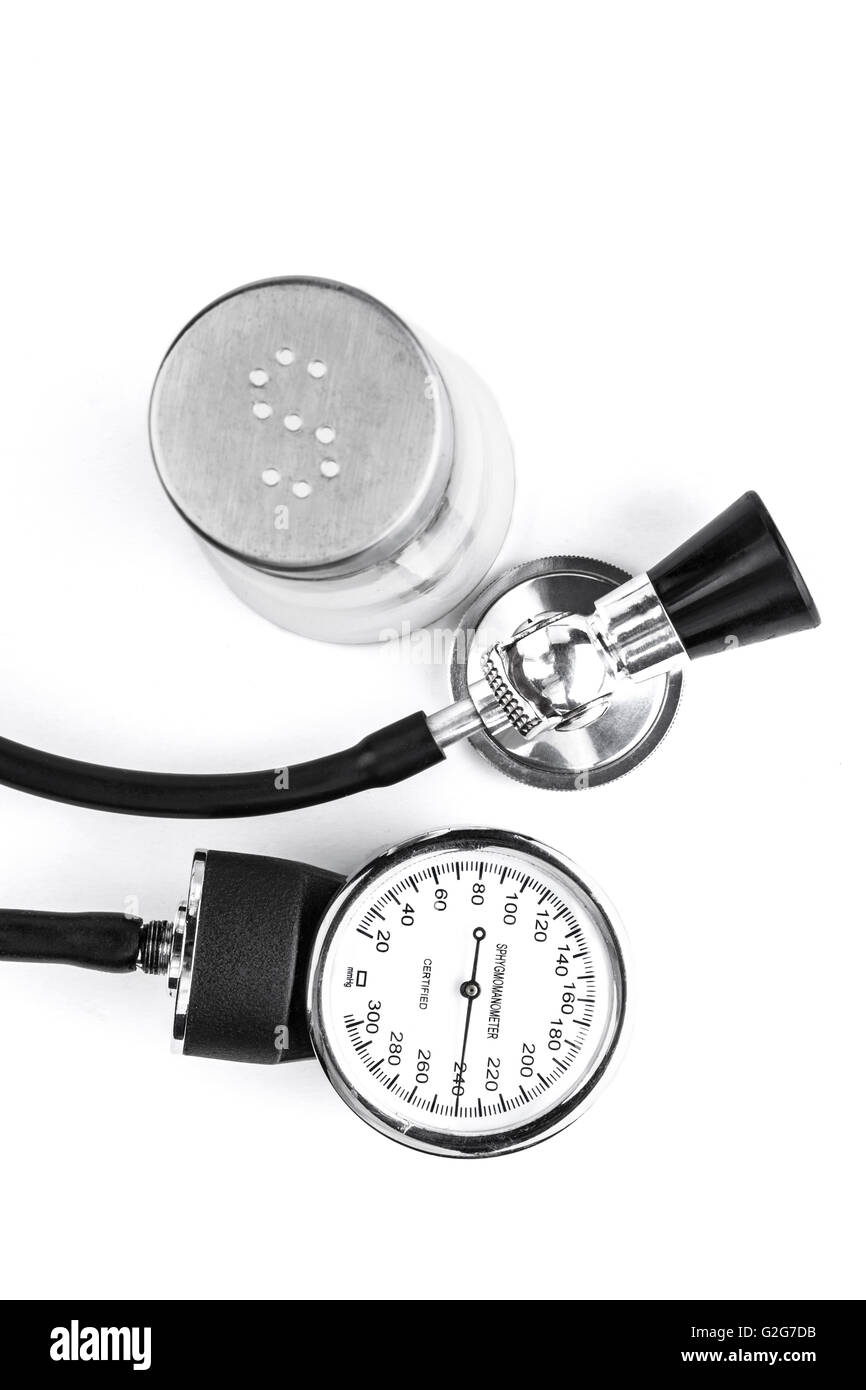 Black stethoscope and sphygmamanometer with salt in the background ...