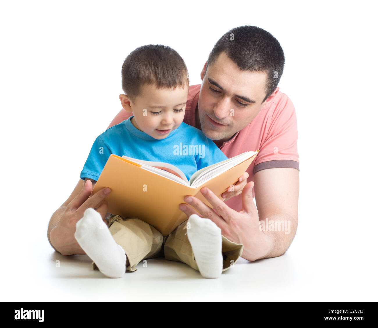 Dad and son reading together Stock Photo - Alamy
