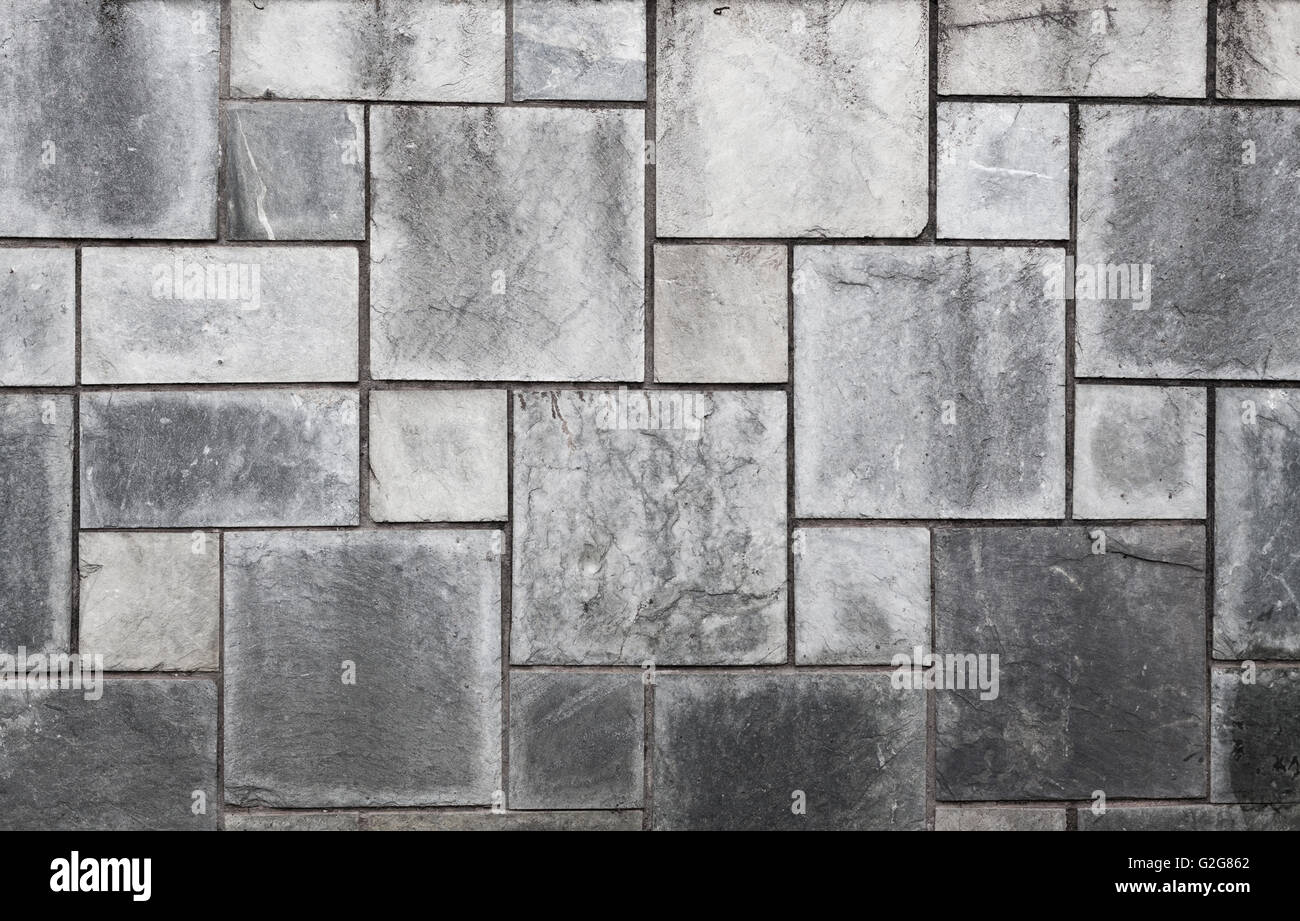 Black rectangular stone wall closeup Stock Photo - Alamy