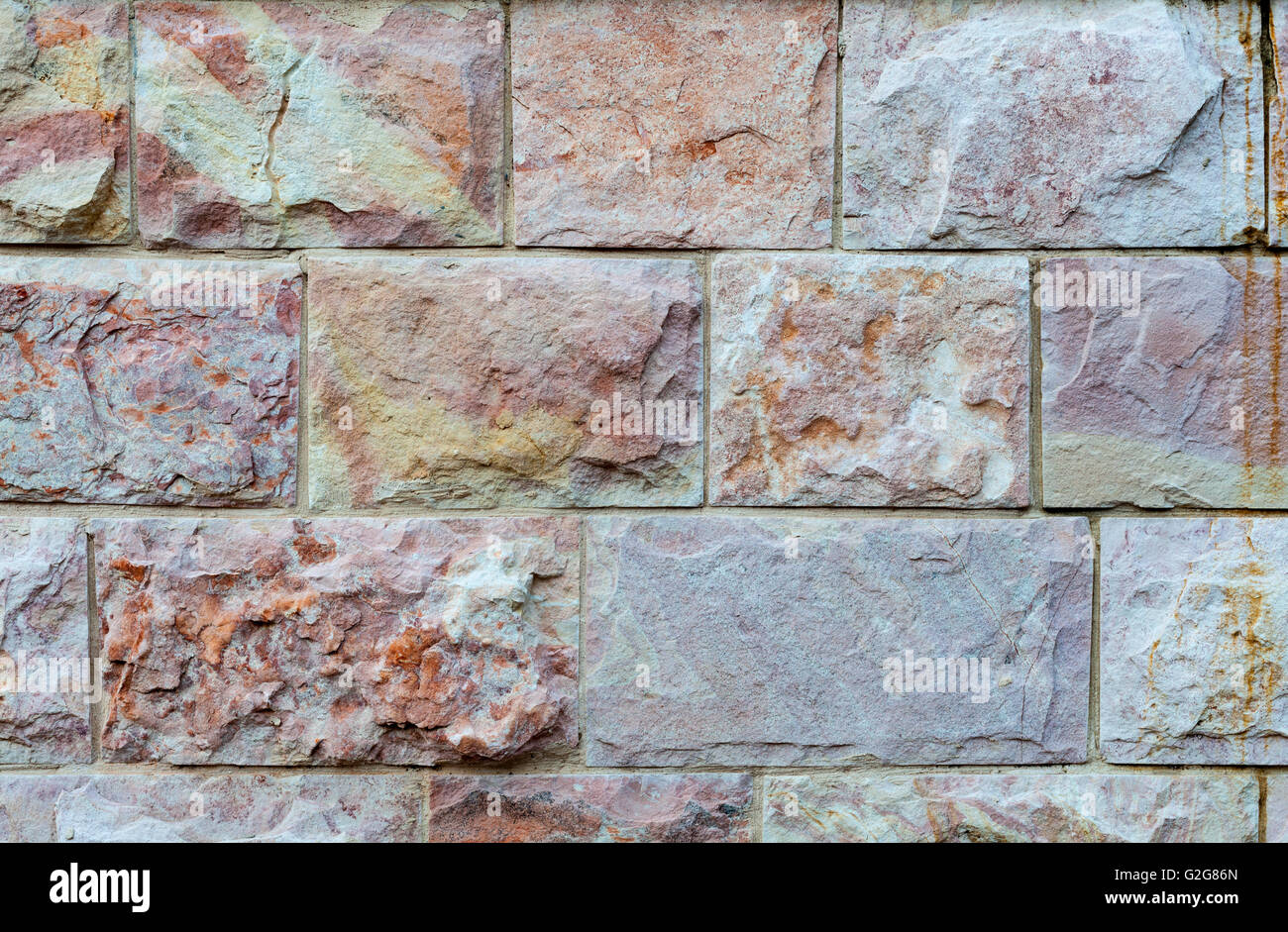 Colored rectangular stone wall closeup Stock Photo - Alamy