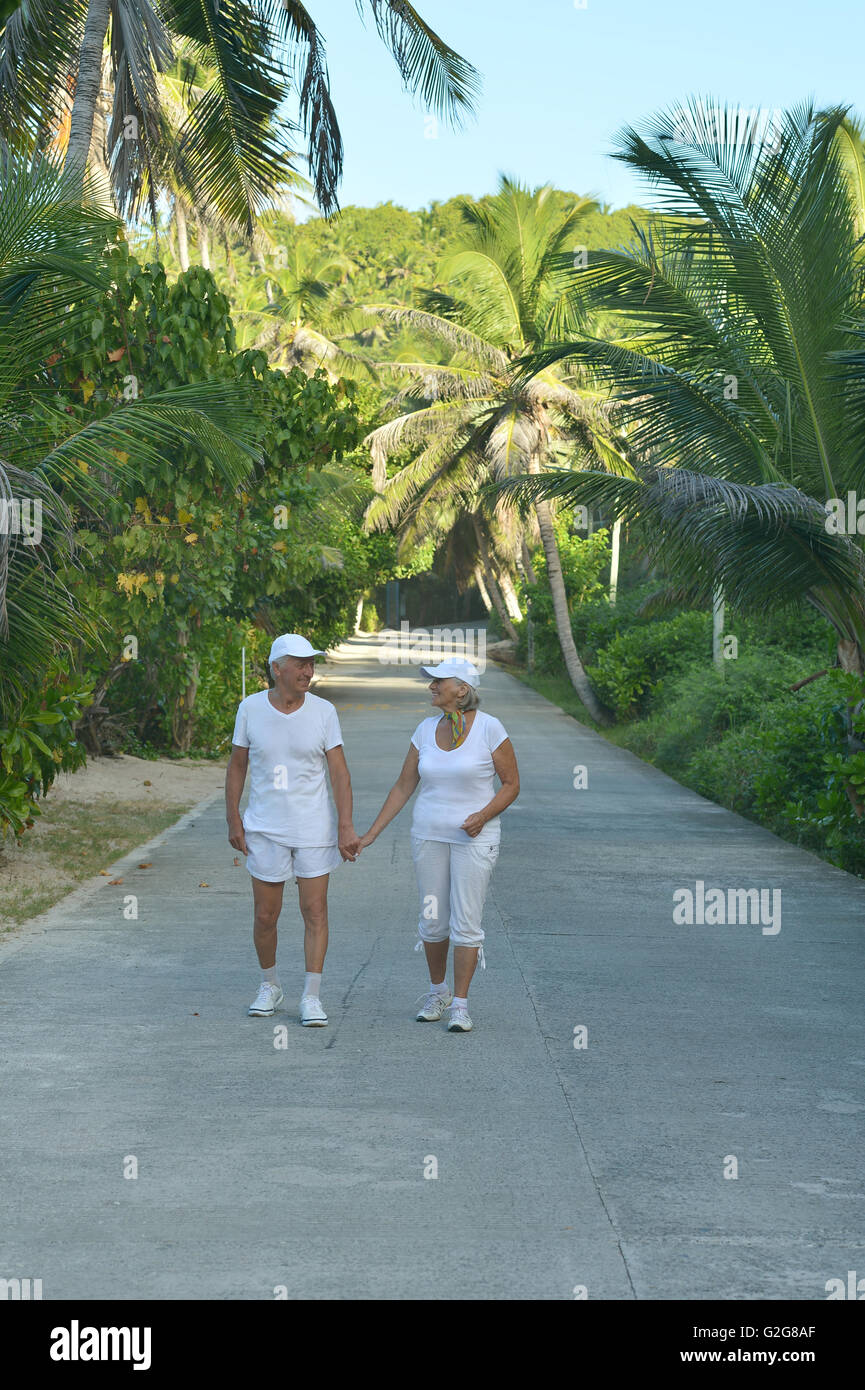 elderly couple rest at tropical resort Stock Photo - Alamy