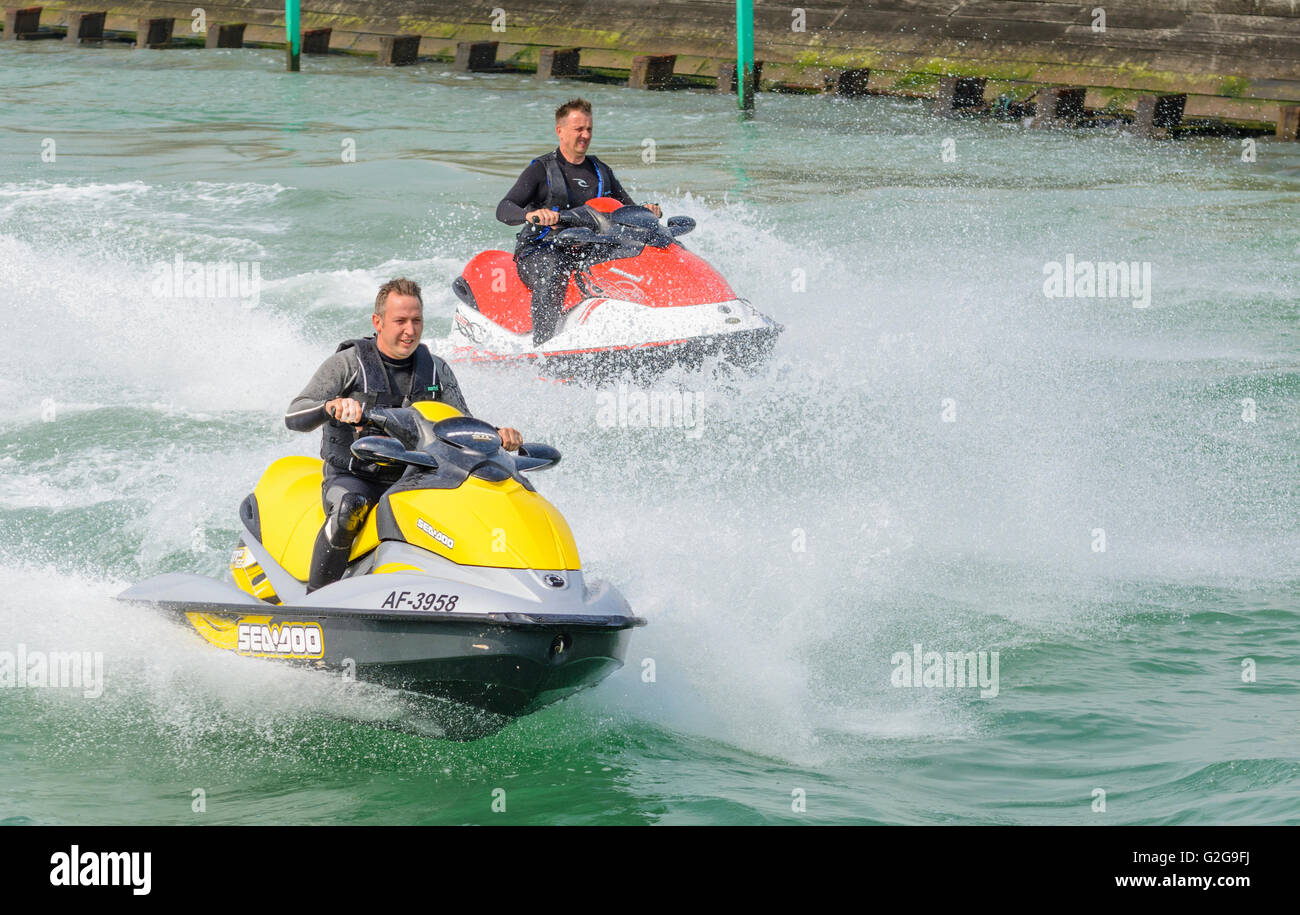 Men jet skiing on a river Stock Photo - Alamy