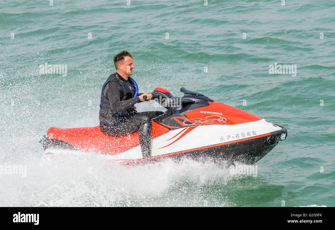 Side view of a jet skier on a river Stock Photo - Alamy
