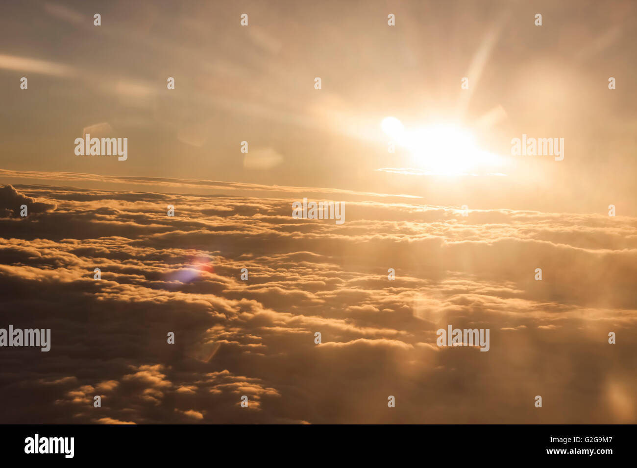 sunrise uppon clouds during morning flight vibrante color Stock Photo ...