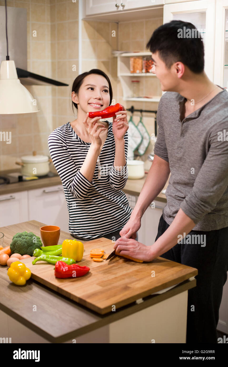 Young couple cooking in kitchen Stock Photo - Alamy