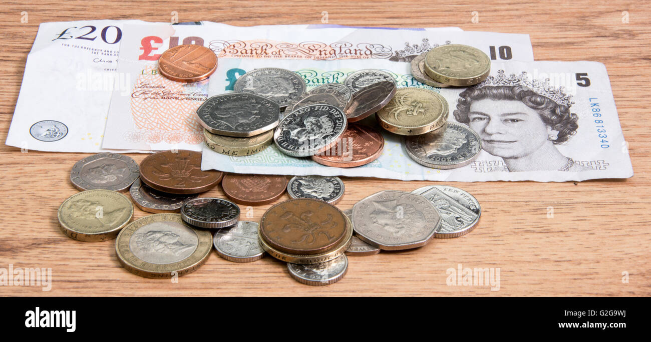 Pile of money of the United Kingdom Stock Photo - Alamy