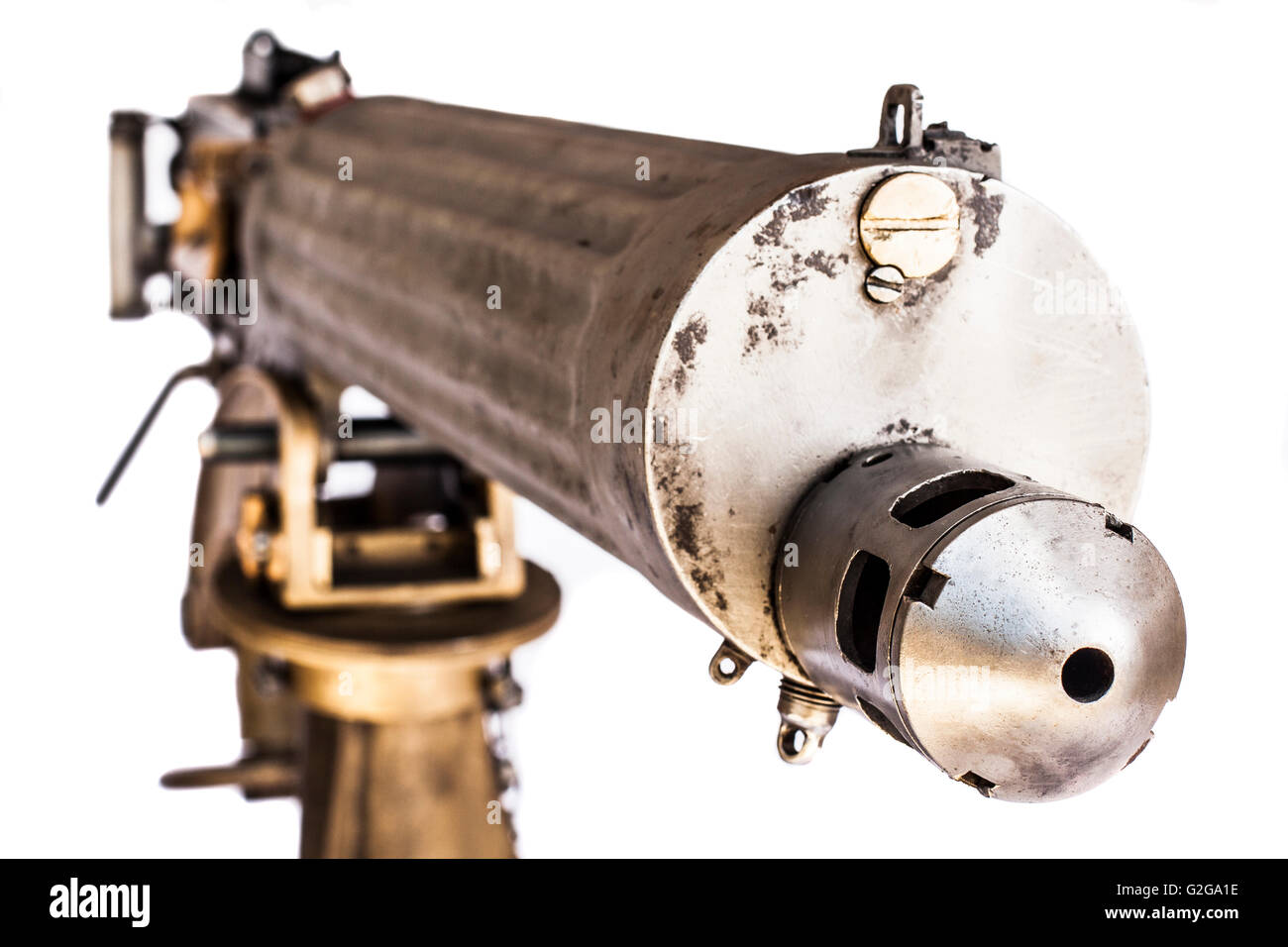 old Silver and gold color machine gun front closeup isolated on white ...